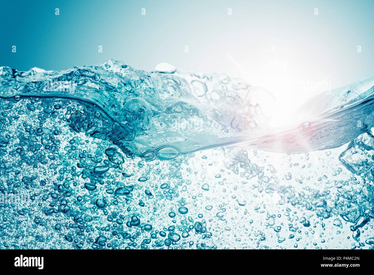 Moving water surface with air bubbles Stock Photo - Alamy