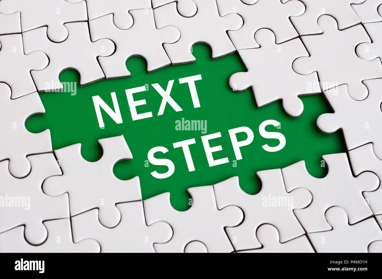 White jigsaw puzzle in assembled state with missing elements forming a ...