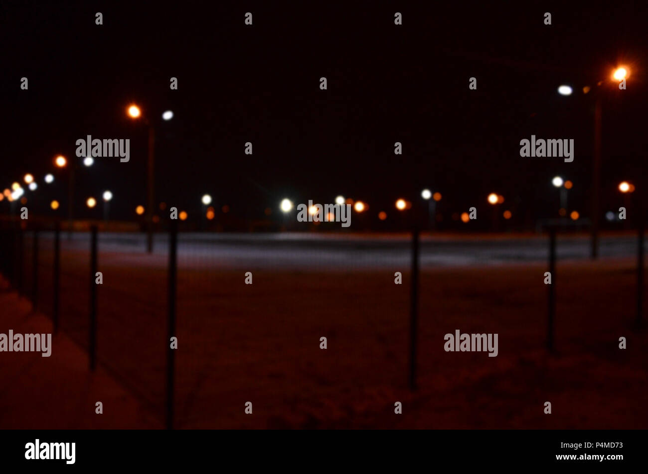 Blurred photo of school playground at night with bright lights Stock ...