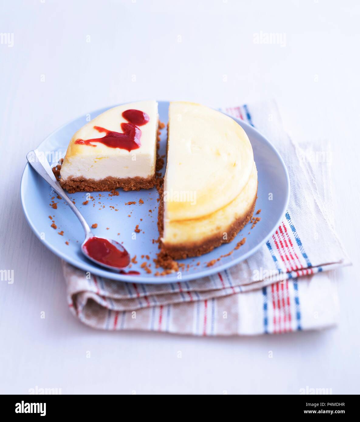 Cheesecake with raspberry sauce Stock Photo - Alamy