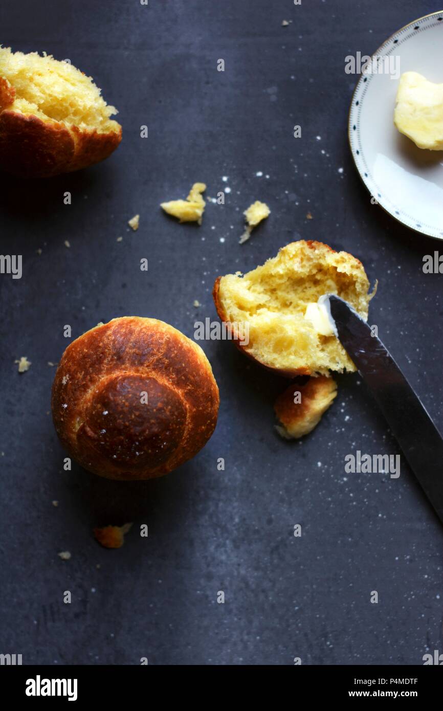 Brioche with butter Stock Photo - Alamy