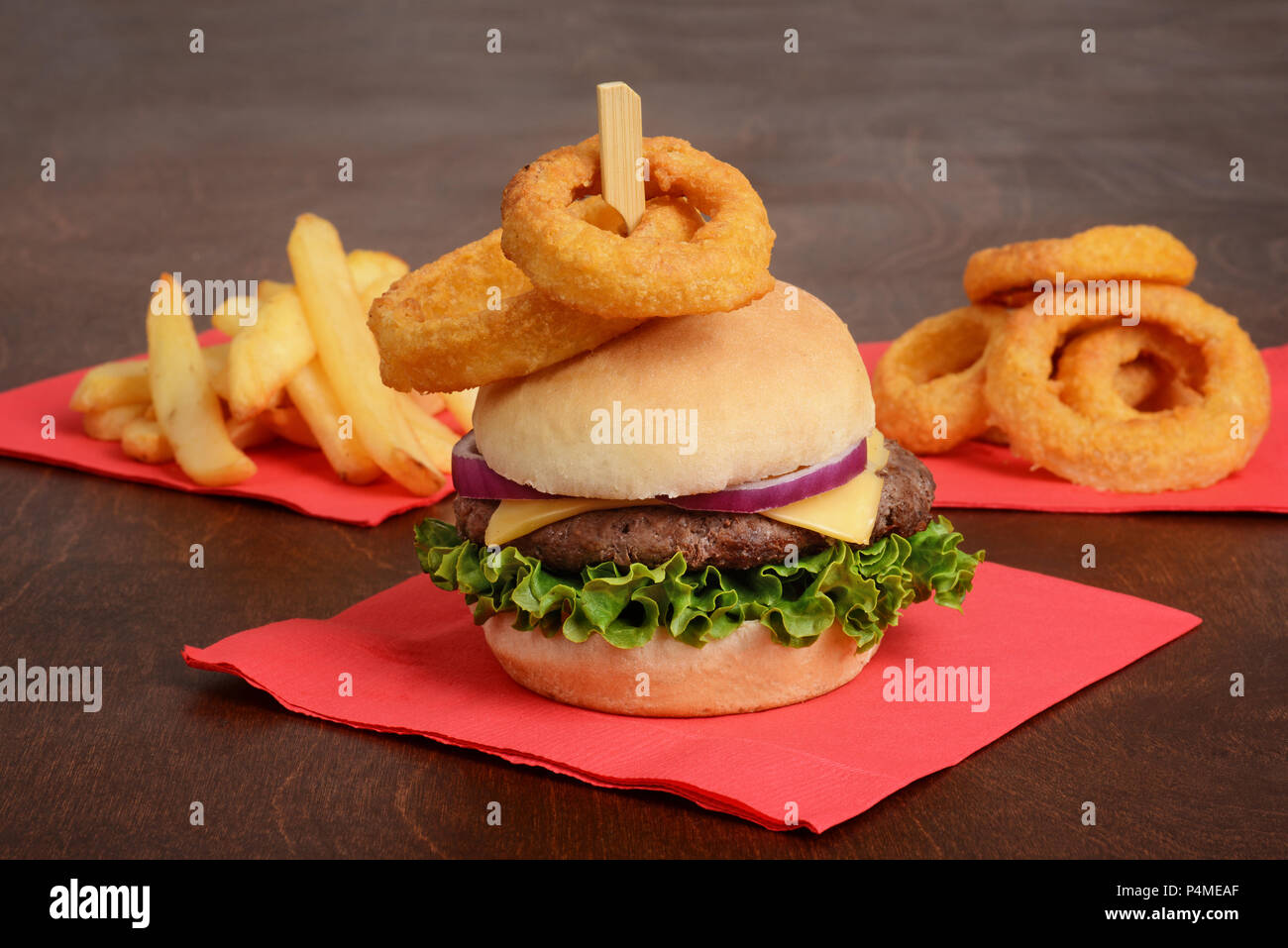 closeup of a hamburger with onion rings on top Stock Photo - Alamy