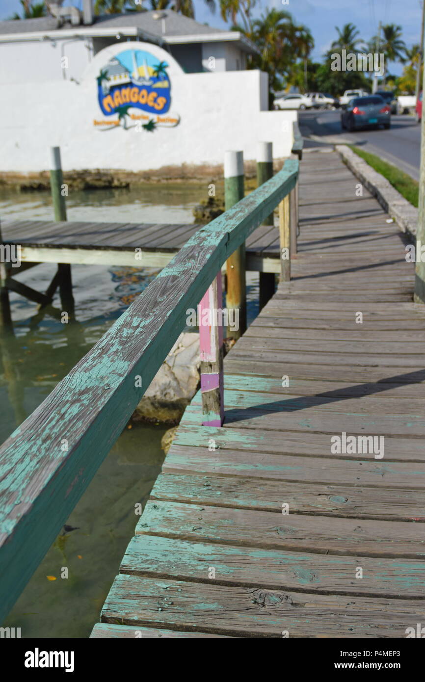 Faded paint walkway along water in downtown Marsh Harbour, Bahamas to ...