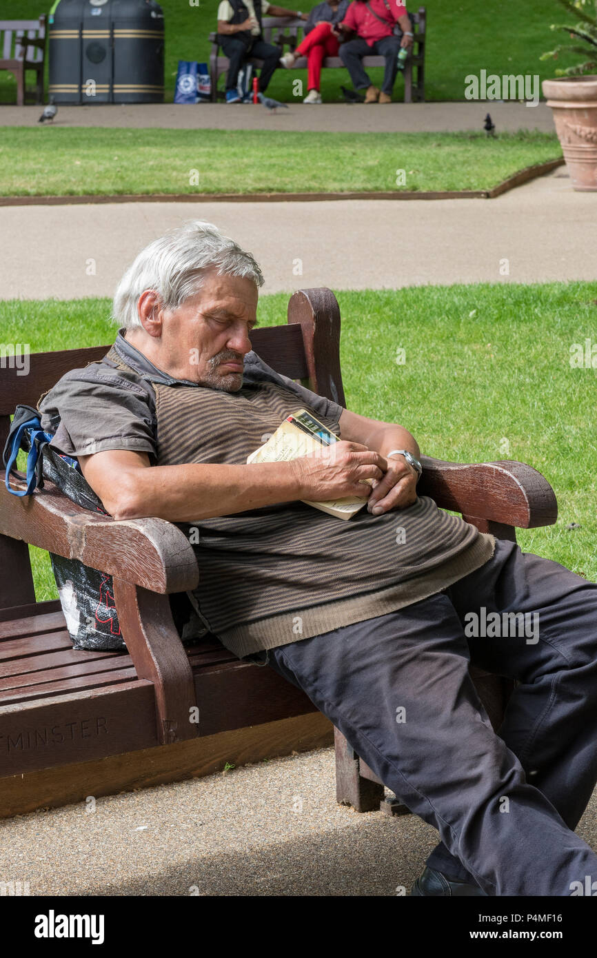 man falling asleep with a book Stock Photo - Alamy