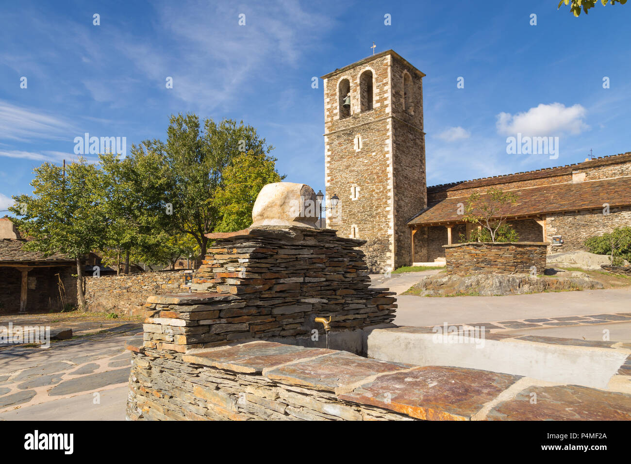 church square with a fountain in the foreground and the church in the ...