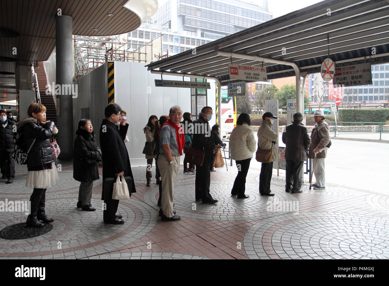 Discipline japanese people are waiting in line to board a public bus in ...