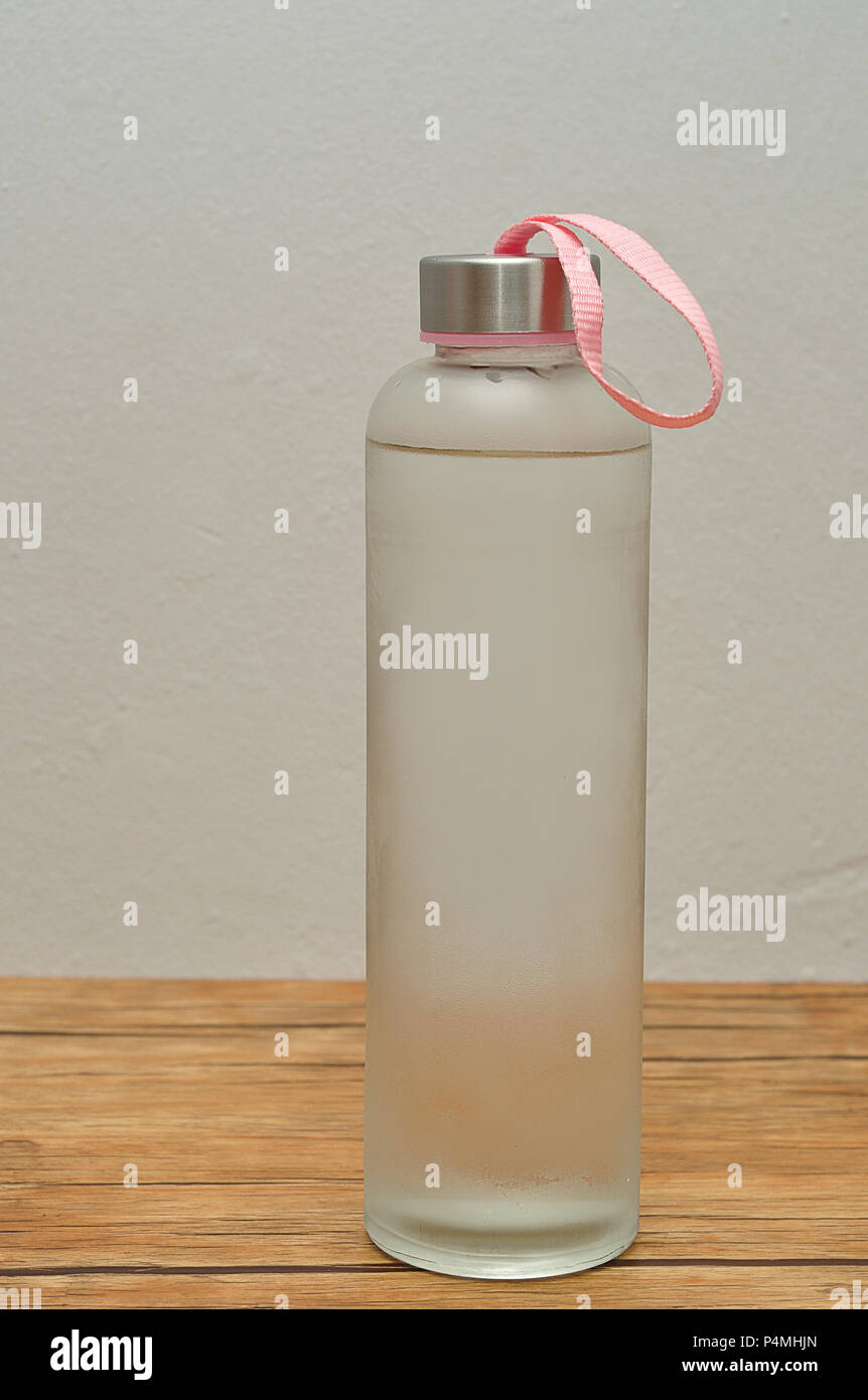 A glass bottle filled with ice cold water Stock Photo - Alamy