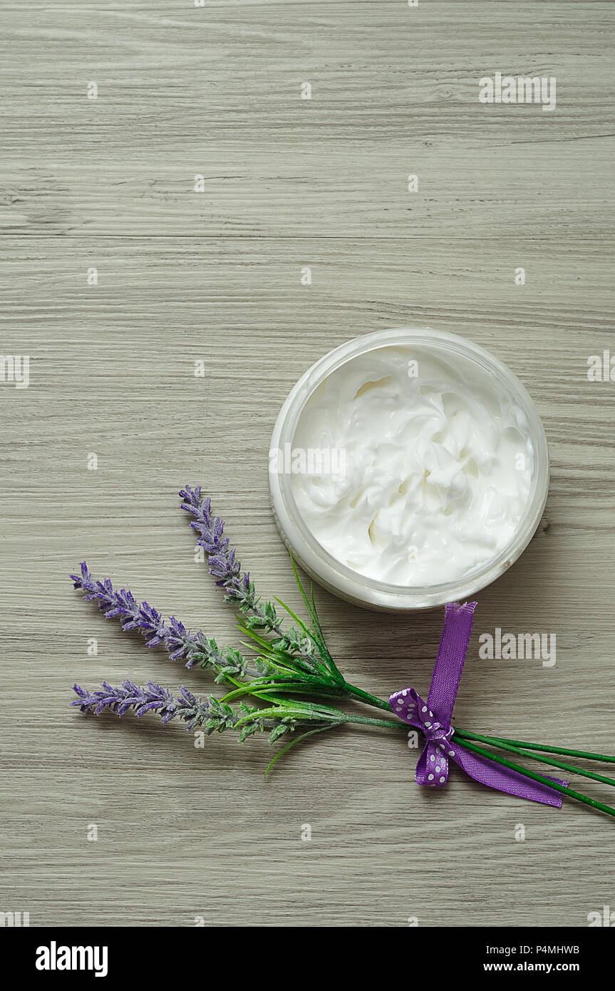 A bunch of lavender displayed with a container white body lotion Stock ...