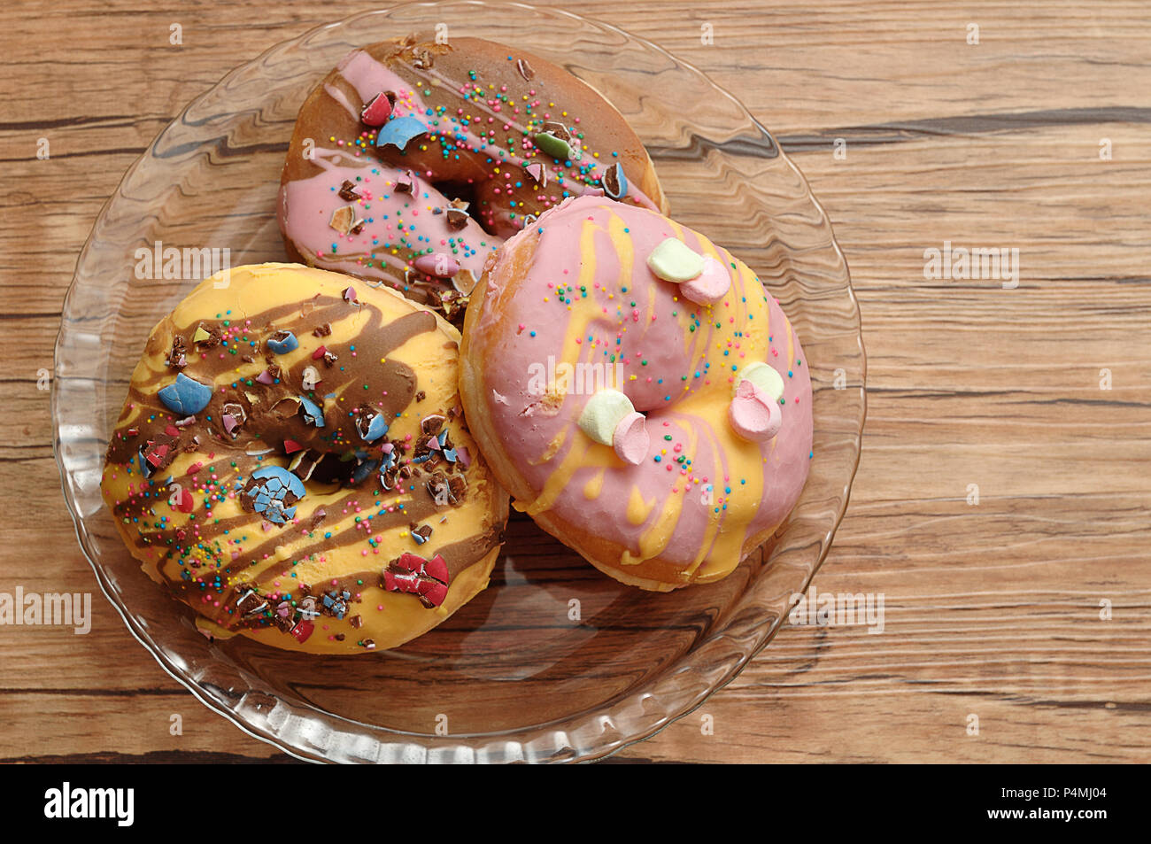 Plate of decorated doughnuts hi-res stock photography and images - Alamy