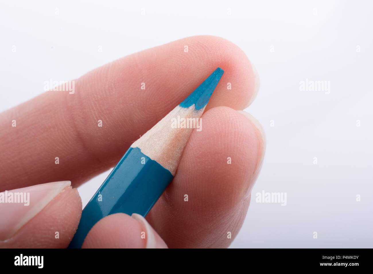 Hand holding color pencil on a white background Stock Photo - Alamy