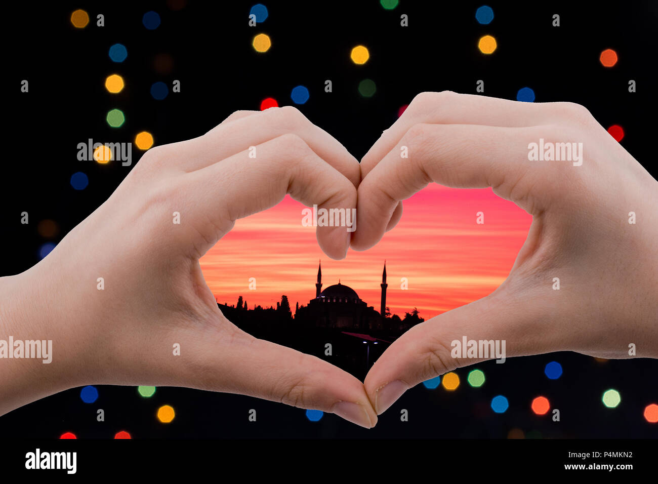Islamic mosque view seen behind a heart shaped hand Stock Photo - Alamy