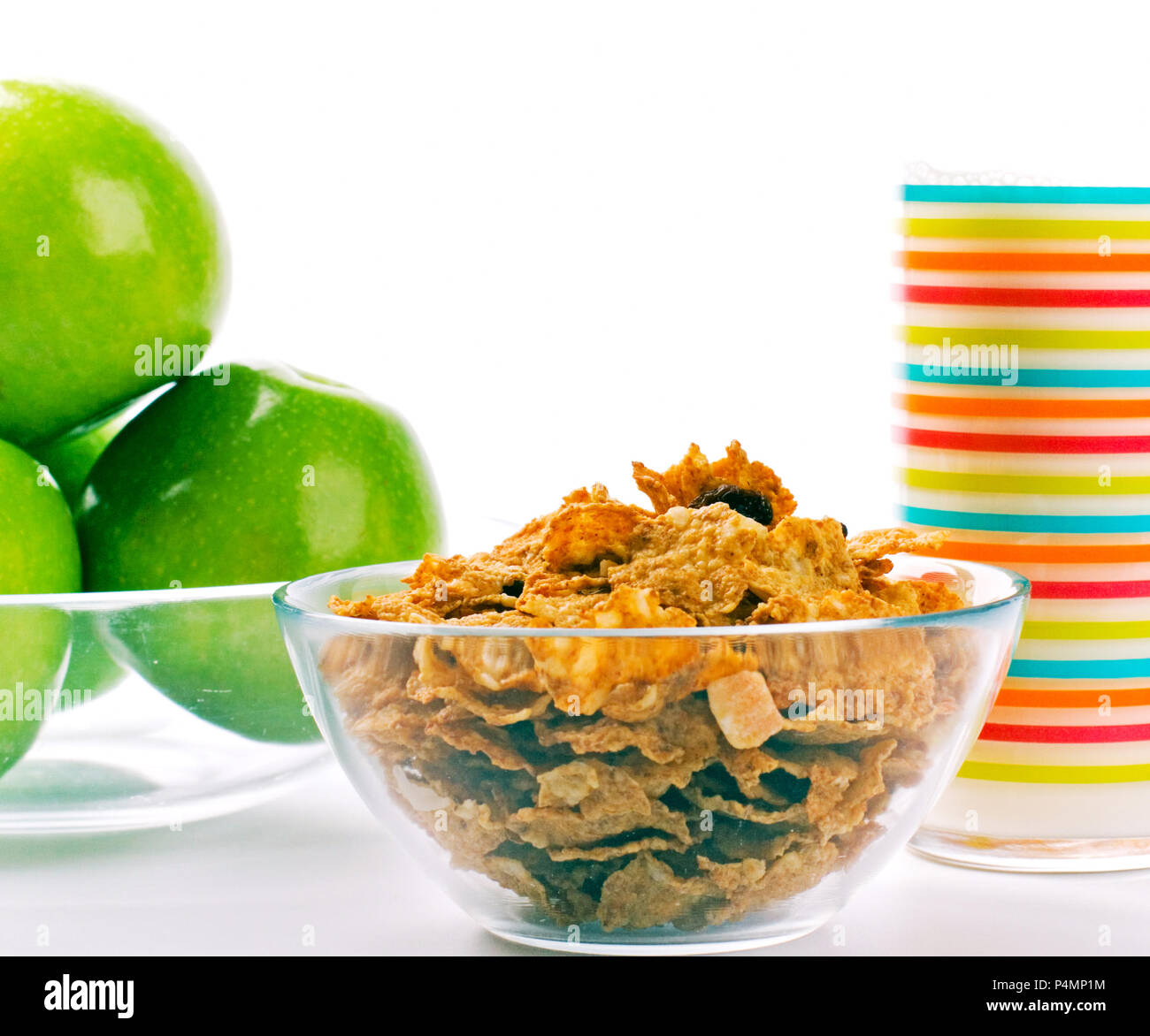 healthy breakfast: cornflakes, glass of milk and green apples Stock ...