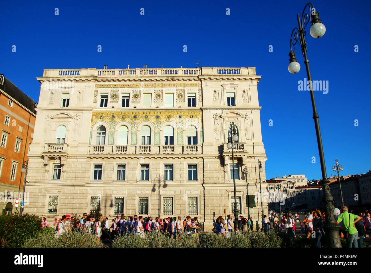Trieste waterfront with people taking part in The Color Run, Italy ...