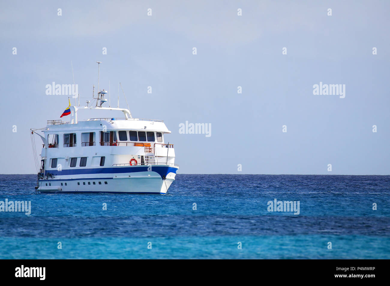 Typical tourist yacht anchored at Gardner Bay near Espanola Island ...