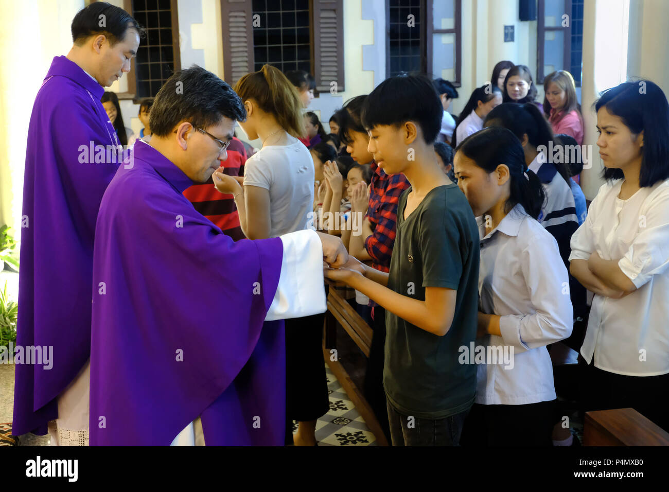 Holy communion (eucharest) during sunday mass in the Catholic Church of ...