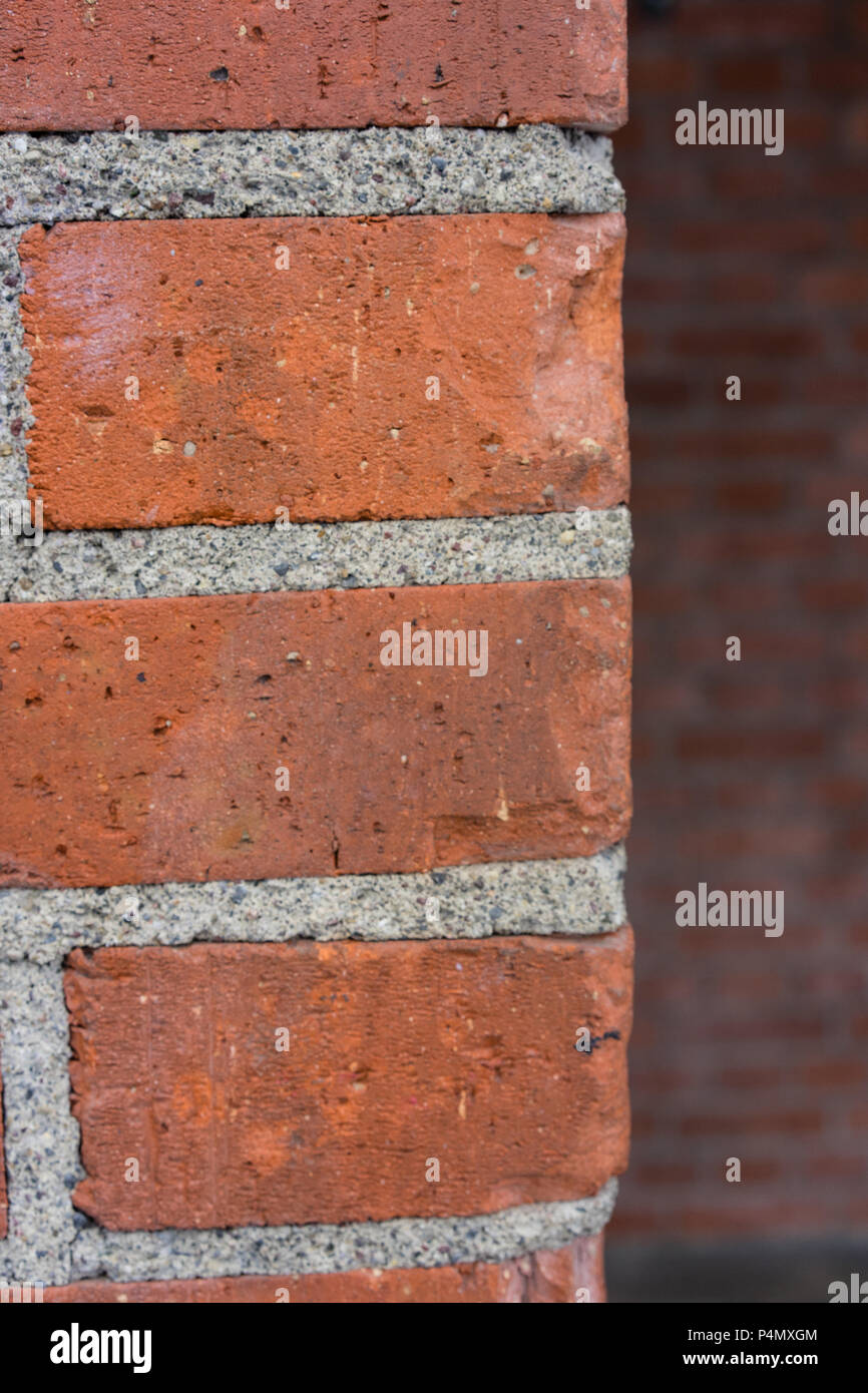 Corner of red brick wall close up view Stock Photo - Alamy