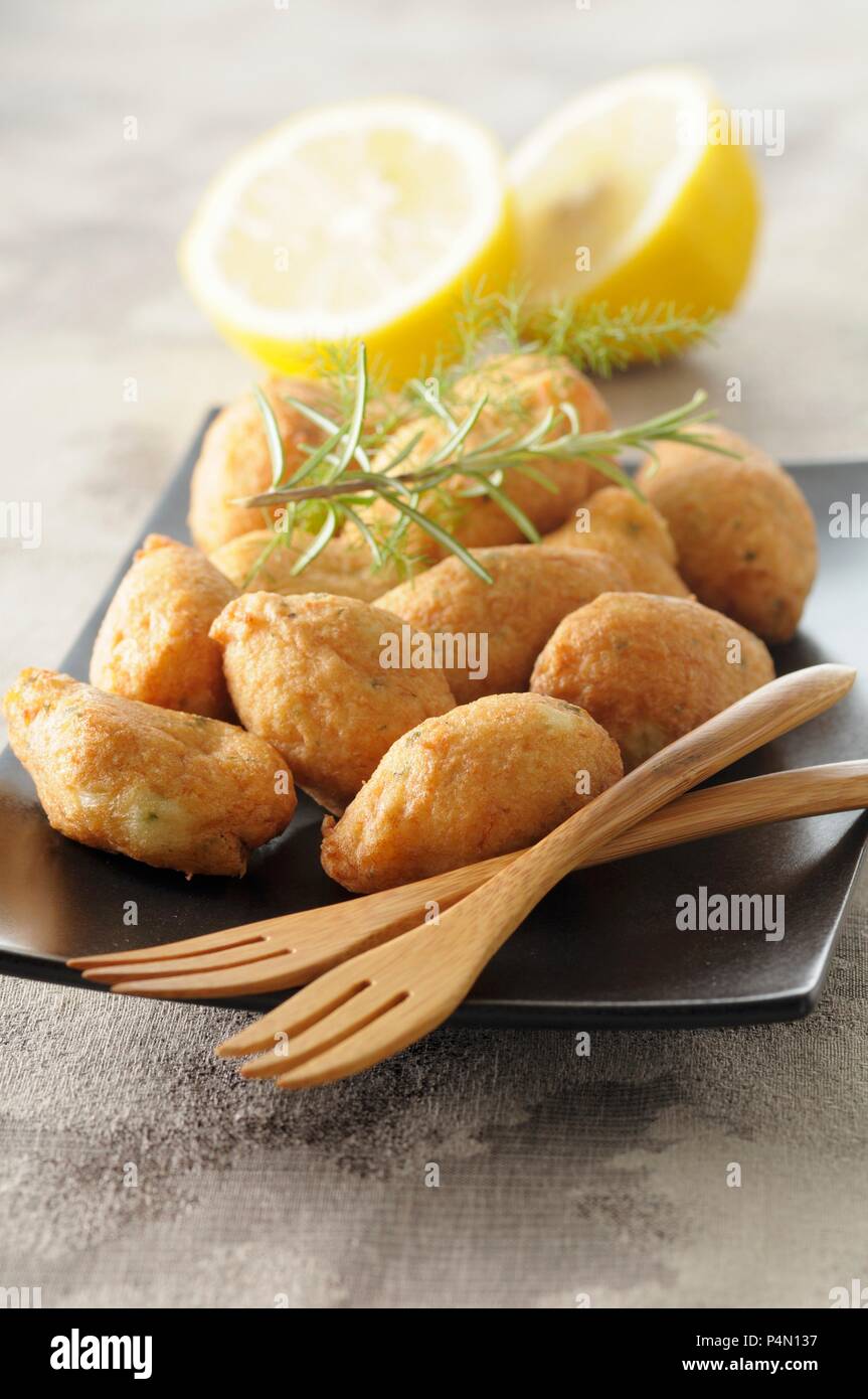 Cod beignets with lemon Stock Photo - Alamy