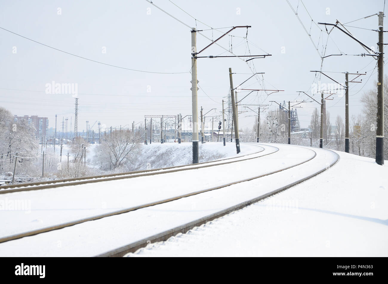 Winter railway landscape, Railway tracks in the snow-covered industrial ...
