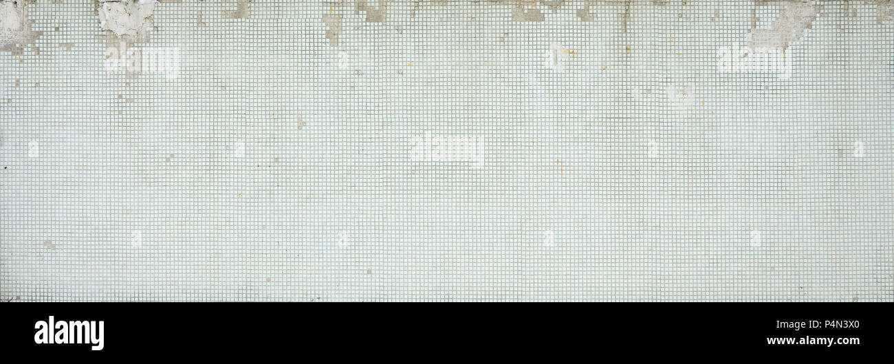 The texture of the old wall, decorated with a lot of square small tiles ...