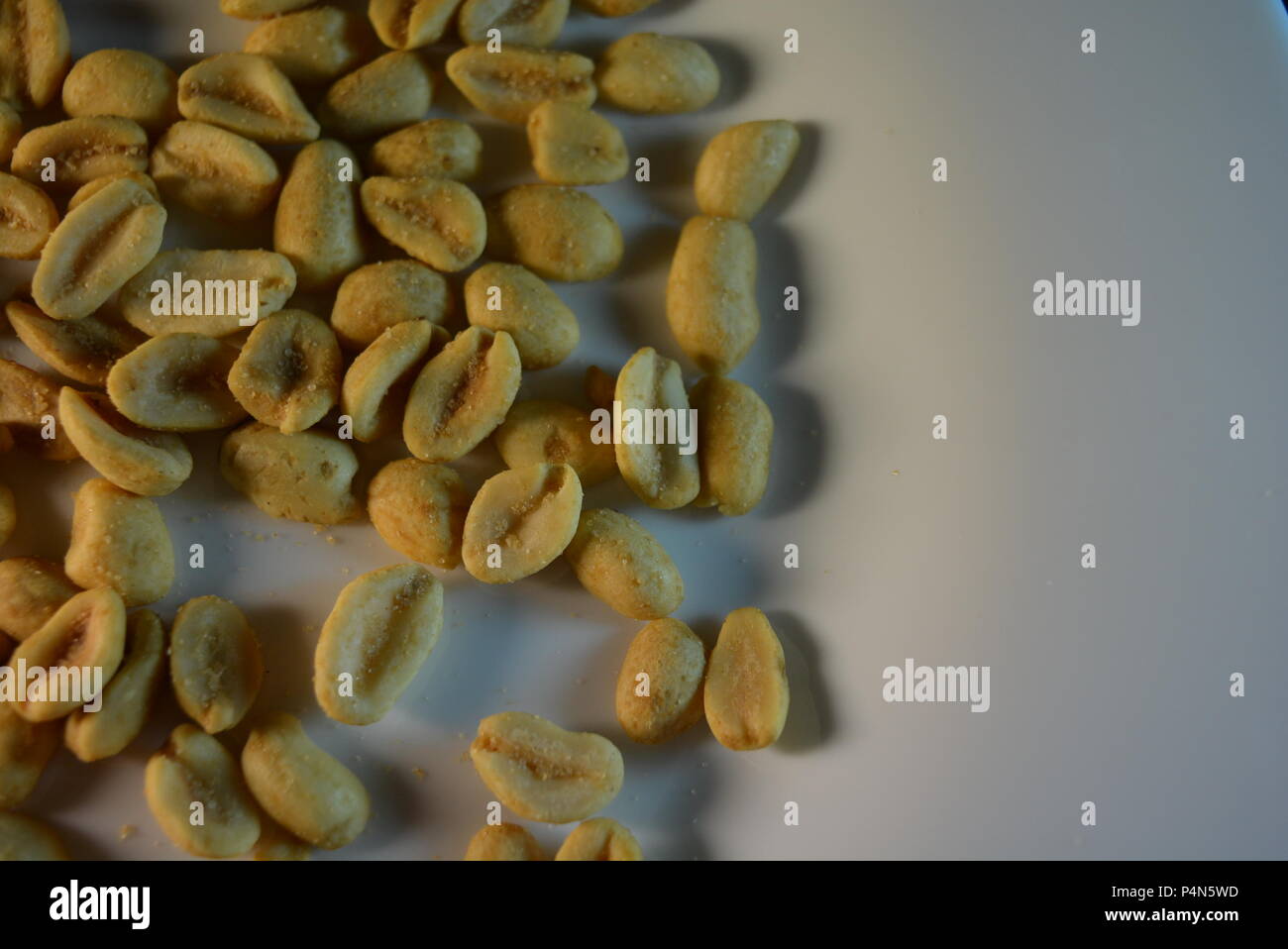 Healthy foods, health, nuts, salted toasted peanuts are arranged ...