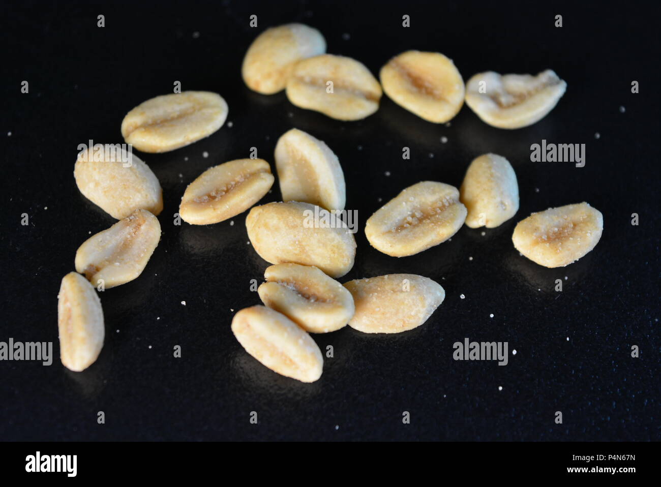 Healthy foods, health, nuts, salted toasted peanuts are scattered ...