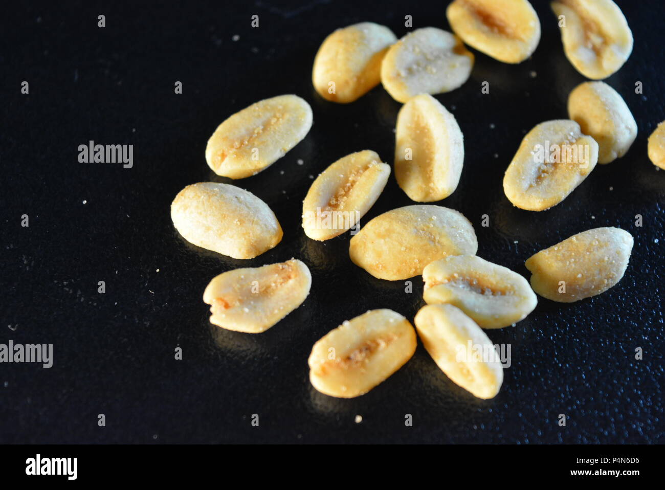 Healthy foods, health, nuts, salted toasted peanuts are scattered ...