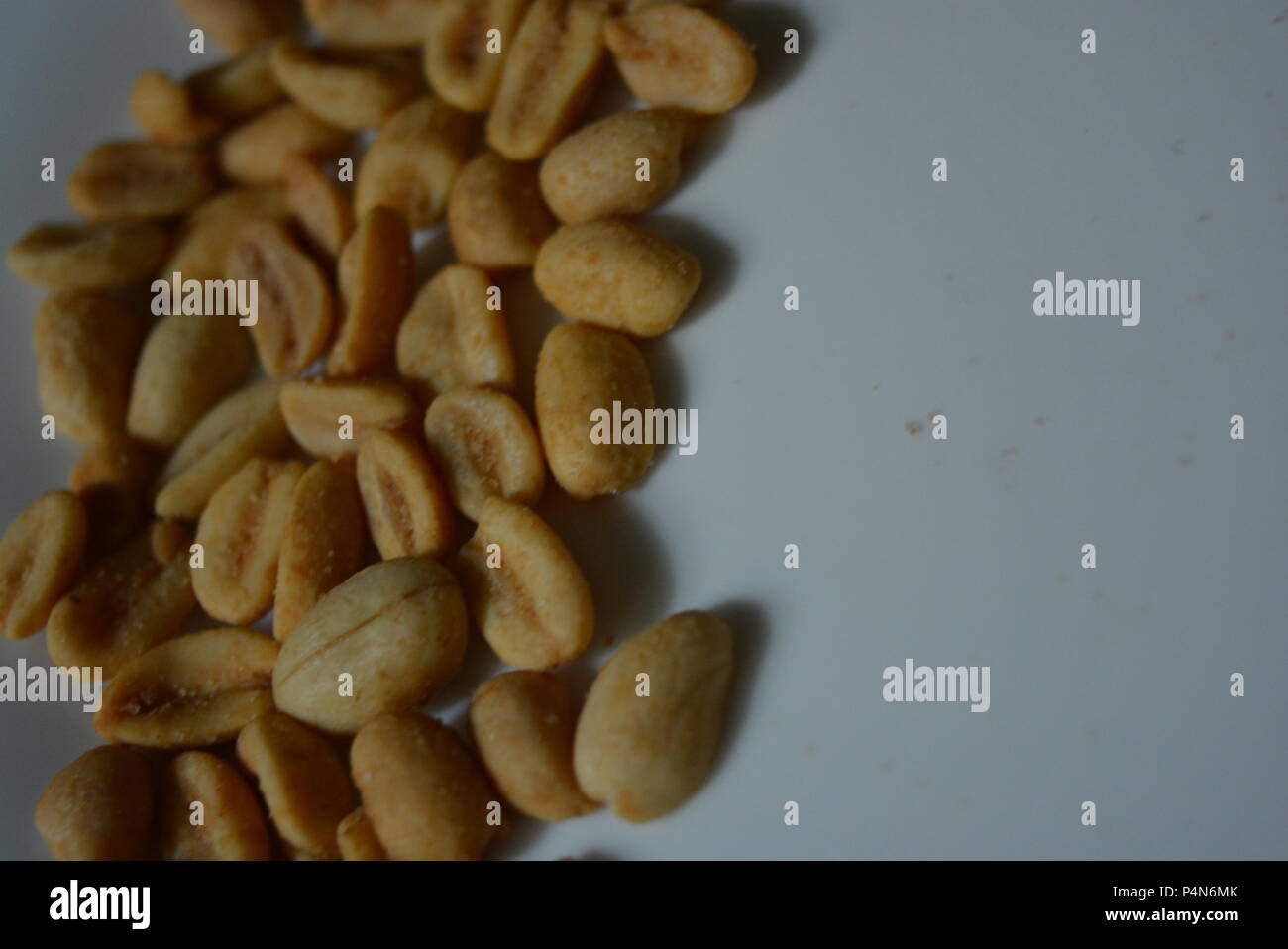 Healthy foods, health, nuts, salted toasted peanuts are arranged ...
