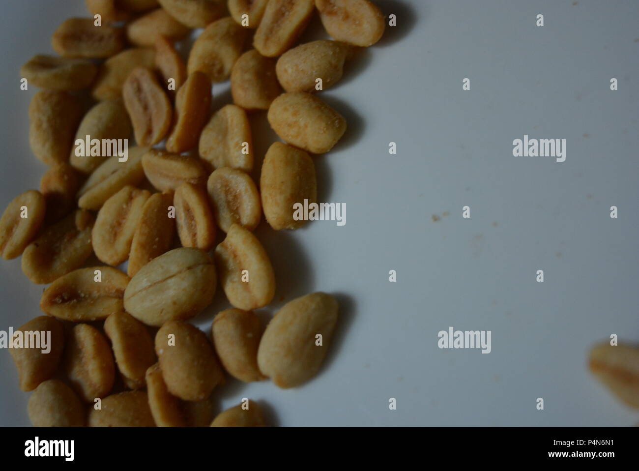 Healthy foods, health, nuts, salted toasted peanuts are arranged ...