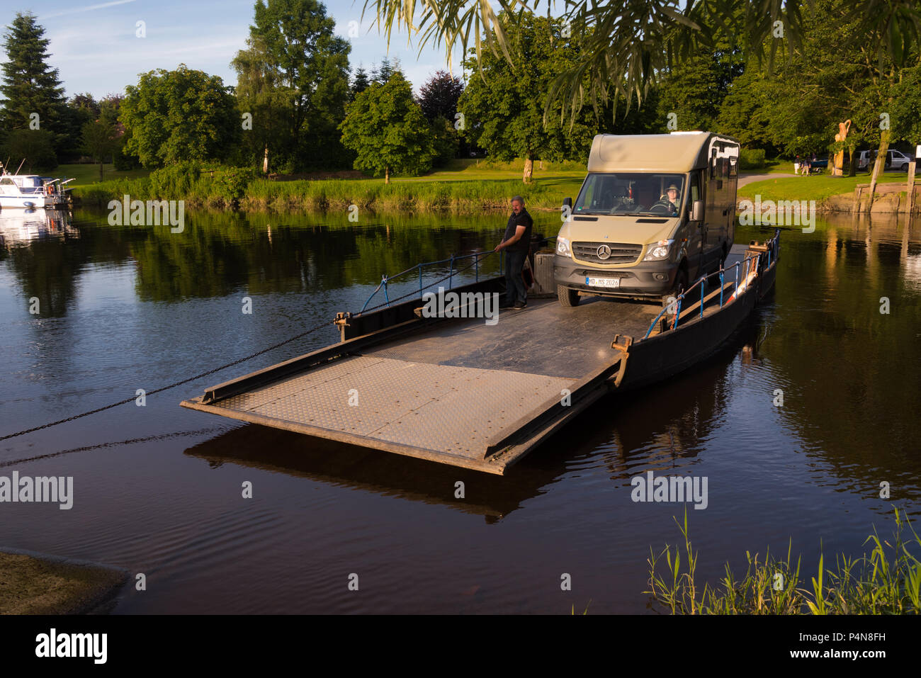 Jul. 2017, Graepel, germany, hand-operated pontoon ferry with car ior ...
