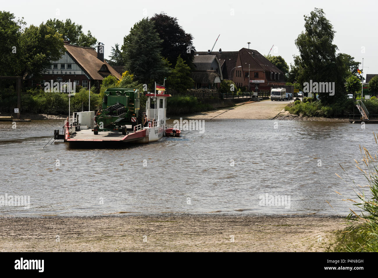 Jul. 2017, Stoer, germany, rope ferry on a canal with Harvester Stock ...