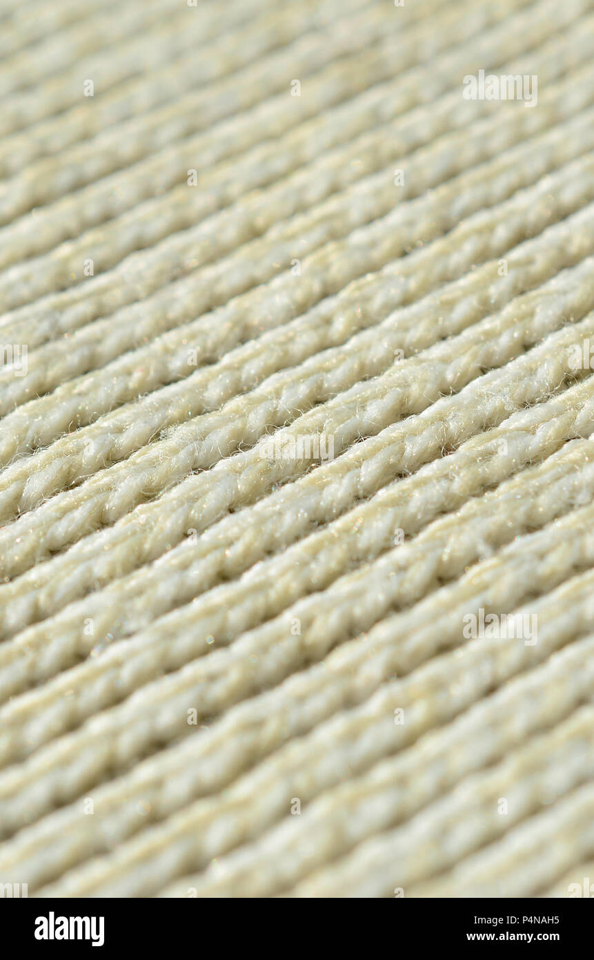 Fabric texture of a soft yellow knitted sweater. Macro image of the ...