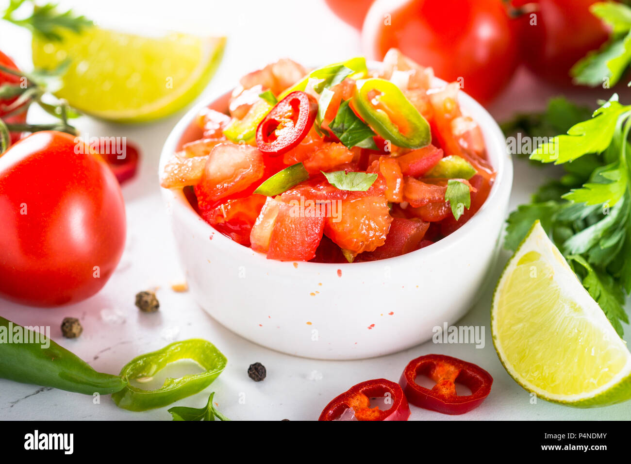 Traditional Latin American mexican salsa sauce and ingredients on white ...