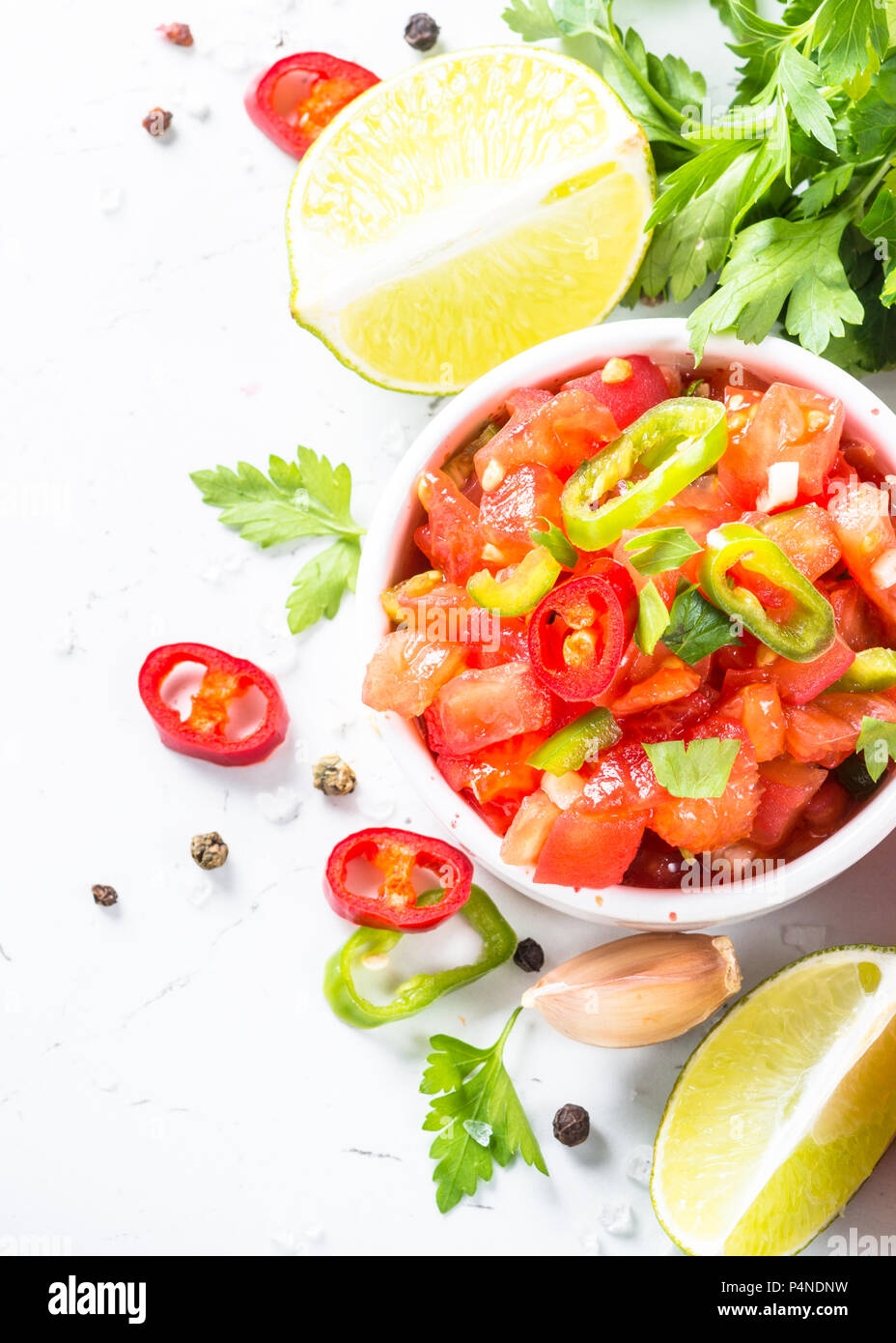 Traditional Latin American mexican salsa sauce and ingredients on white ...