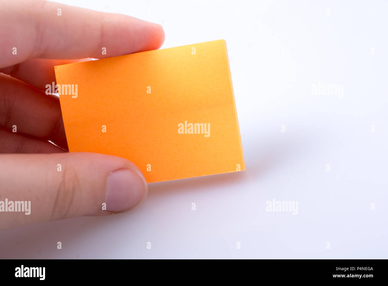 Post note office sticker for taking notes in hand Stock Photo - Alamy