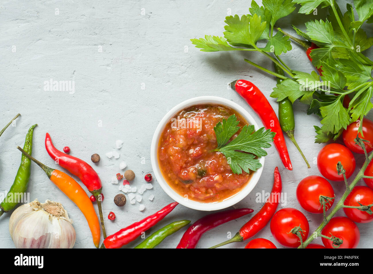 Sauce, ketchup, Lecho in plate. Chili cherry tomatoes garlic and other ...