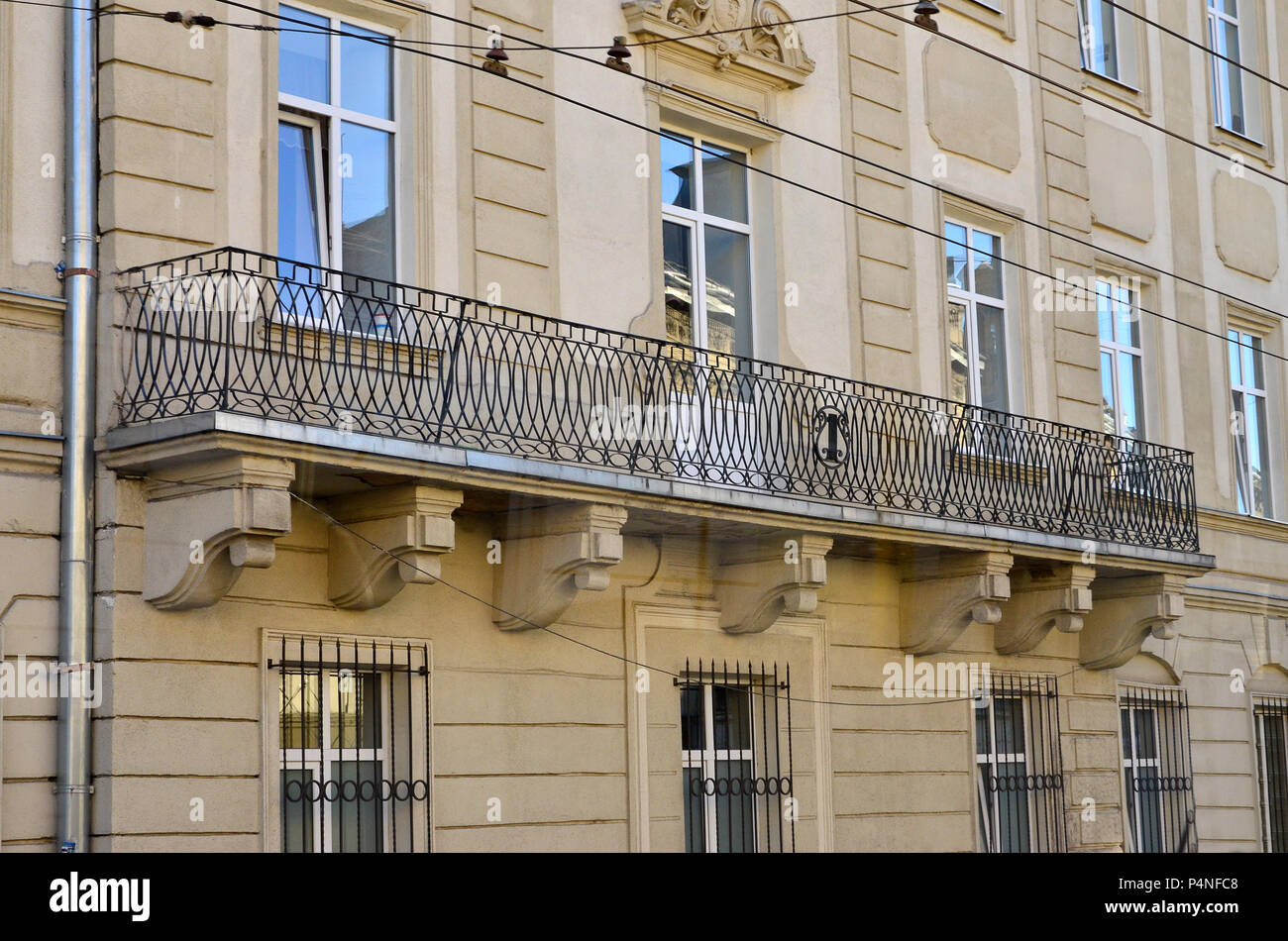 Image of an old wrought-iron frame on the balcony of a multi-storey ...