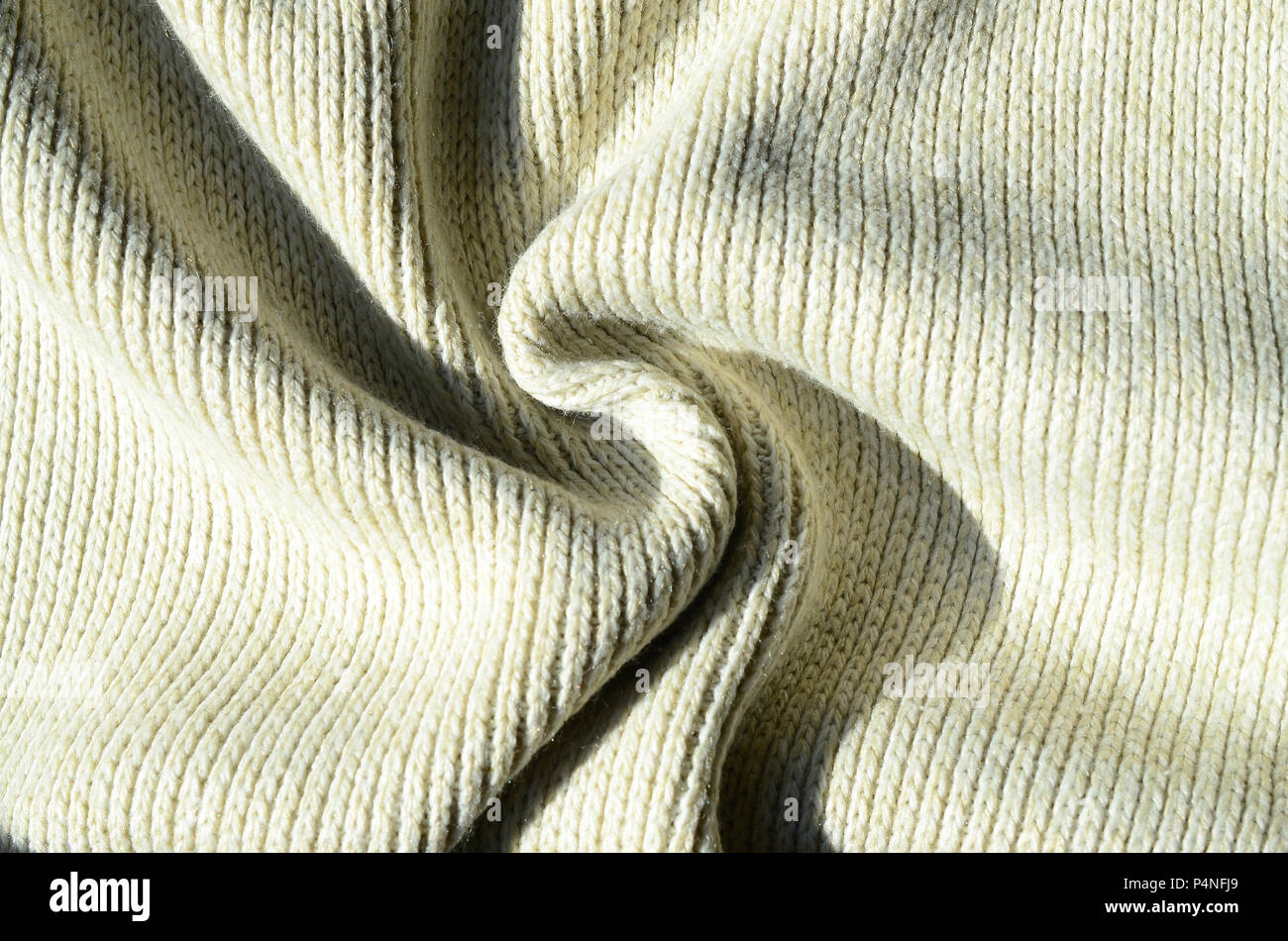 Fabric texture of a soft yellow knitted sweater. Macro image of the ...