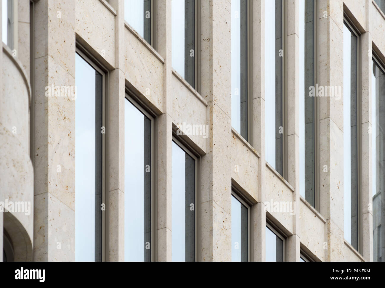 Detailed view of a building with high straight windows, strict geometry ...