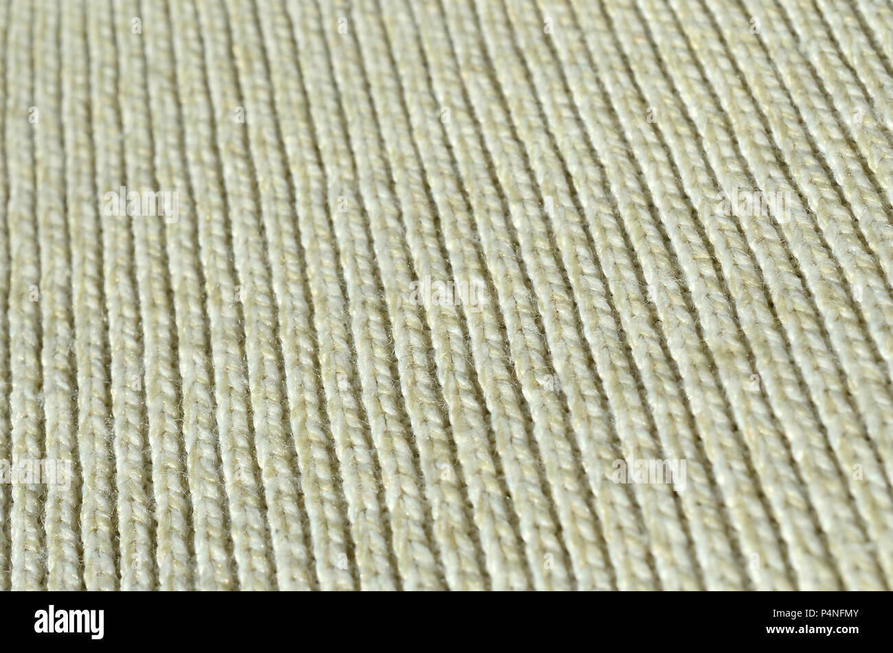 Fabric texture of a soft yellow knitted sweater. Macro image of the ...
