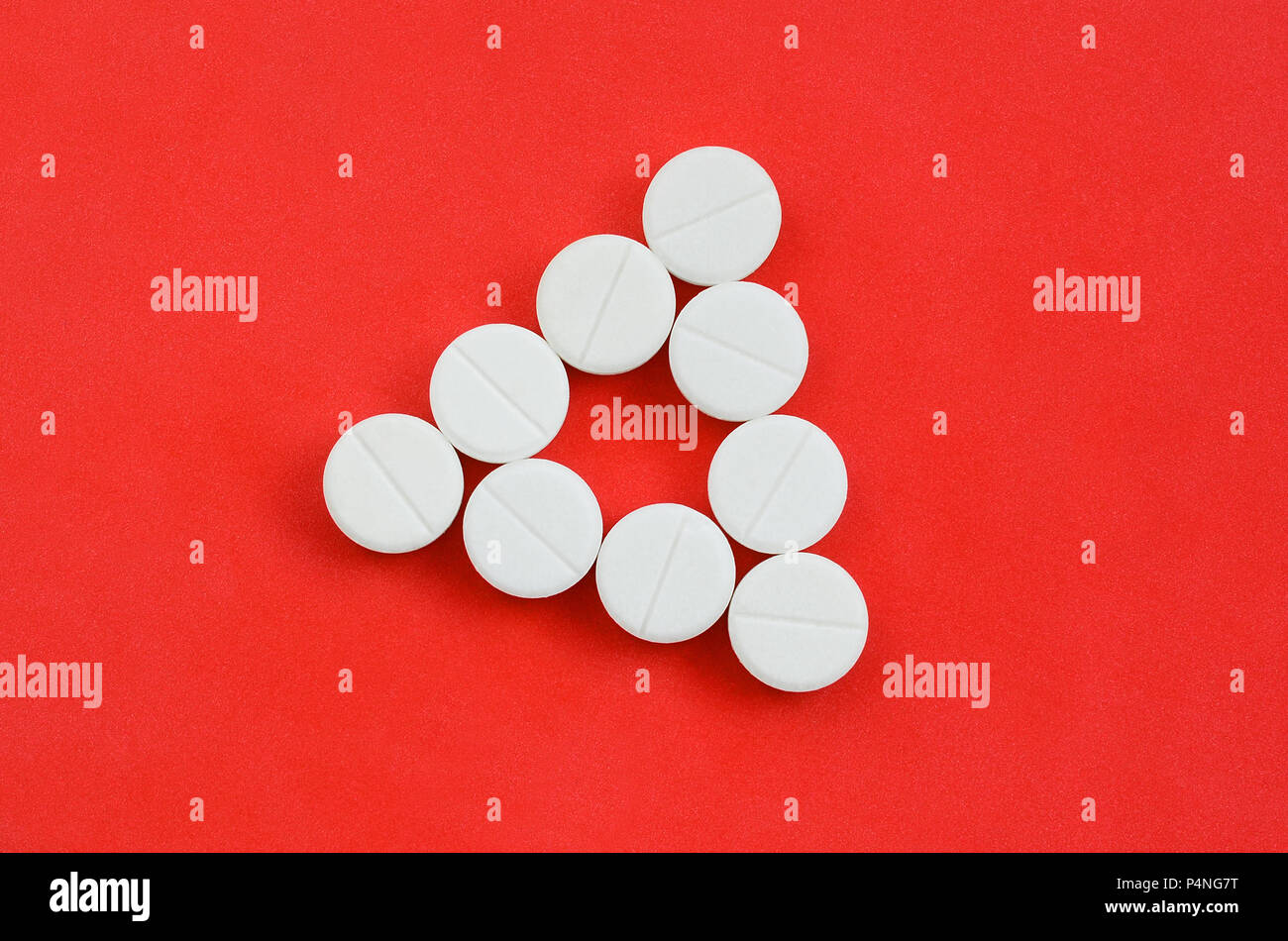 Pink pills in form triangle hi-res stock photography and images - Alamy
