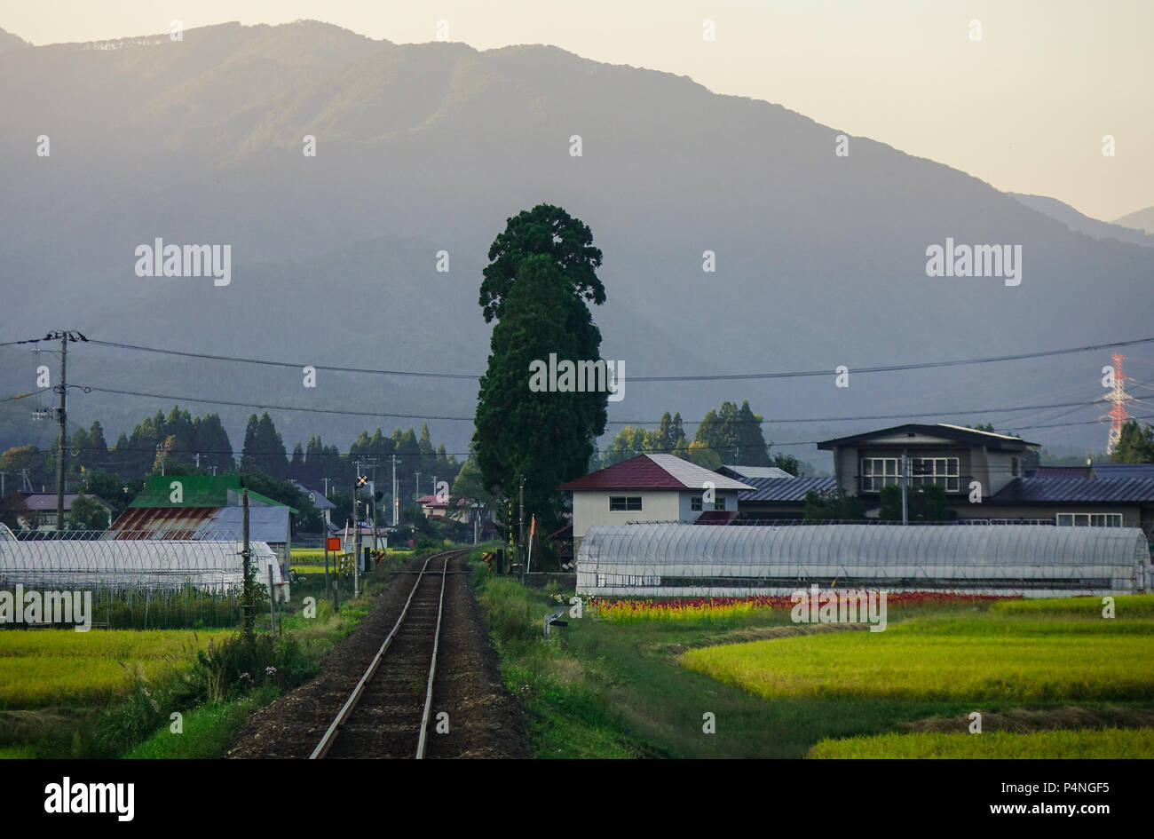 Rail track with rural scenery at sunset in Hokkaido, Japan Stock Photo ...