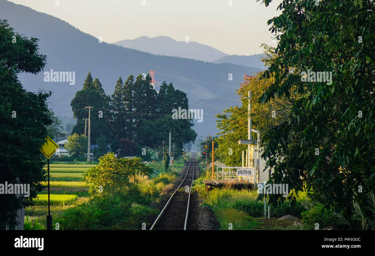 Rail track with rural scenery at sunset in Hokkaido, Japan Stock Photo ...
