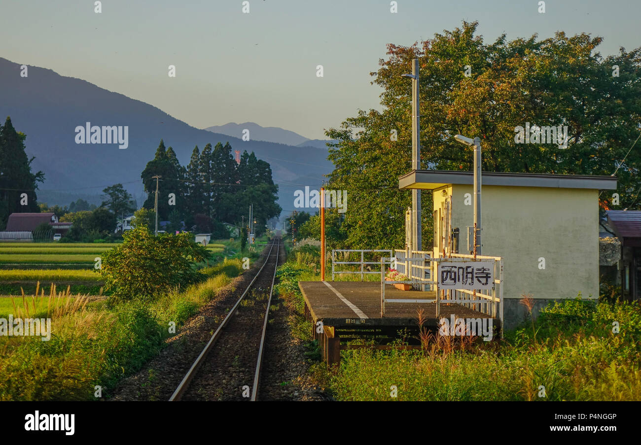 Rail track with rural scenery at sunset in Hokkaido, Japan Stock Photo ...