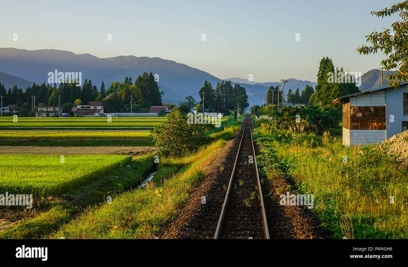 Rural scenery with the rail track at summer day in Hokkaido, Japan ...