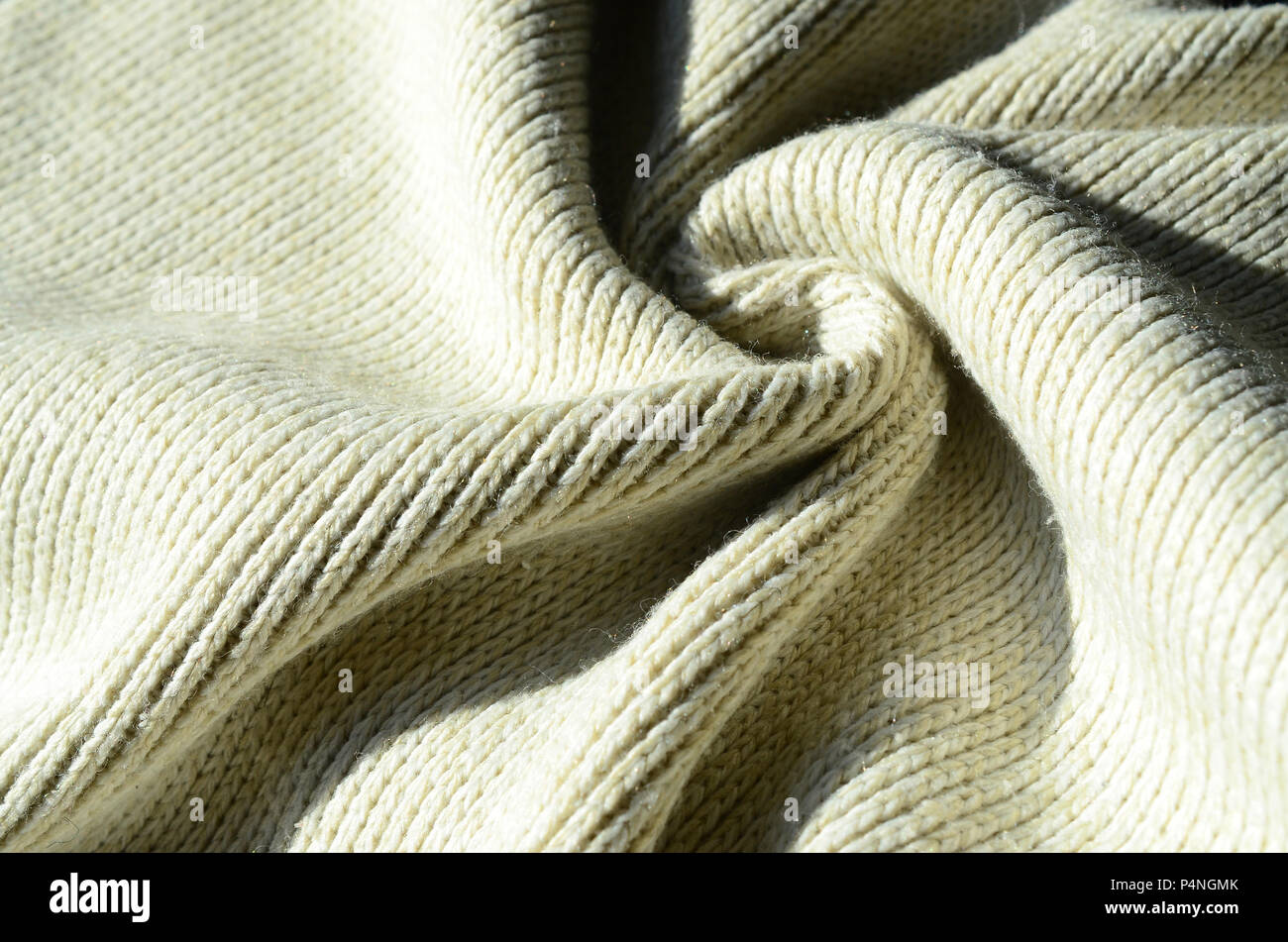 Fabric texture of a soft yellow knitted sweater. Macro image of the ...