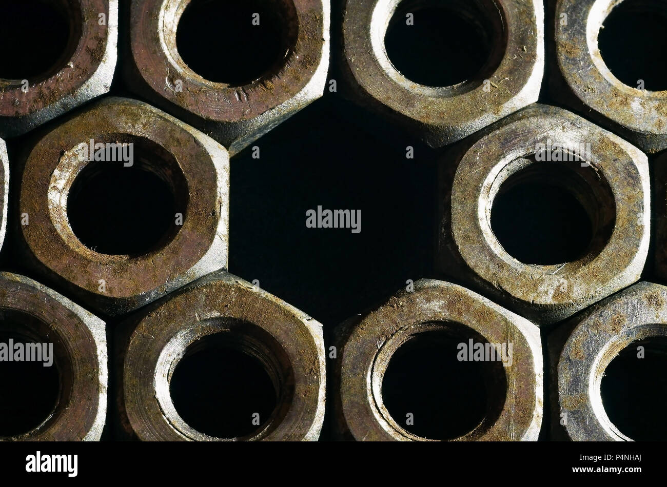Closeup of a pile of rusty nuts. Retro industrial concept Stock Photo ...
