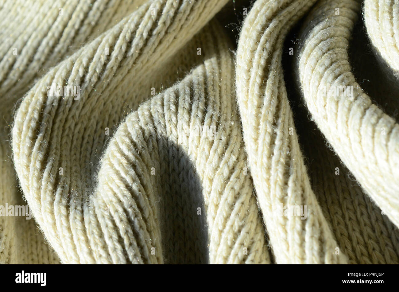 Fabric texture of a soft yellow knitted sweater. Macro image of the ...