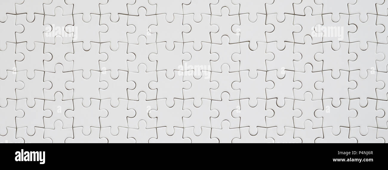 Close up texture of a white jigsaw puzzle in assembled condition. Top ...