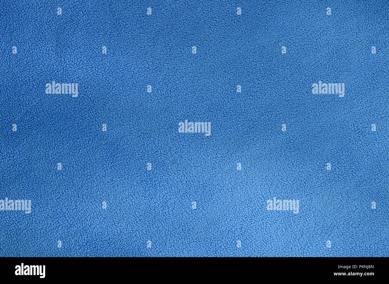 The blanket of furry blue fleece fabric. A background texture of light ...