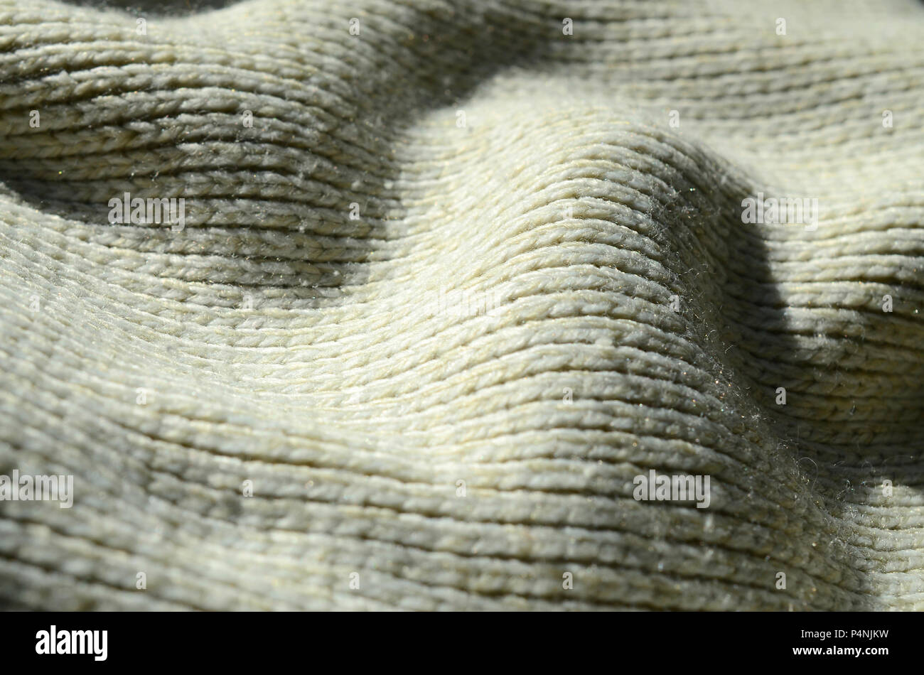 Fabric texture of a soft yellow knitted sweater. Macro image of the ...